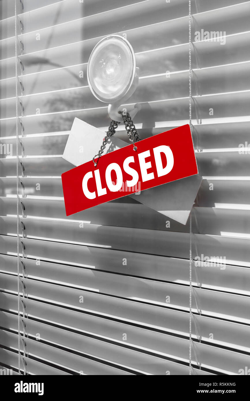 Closed sign board hanging outside store Stock Photo - Alamy