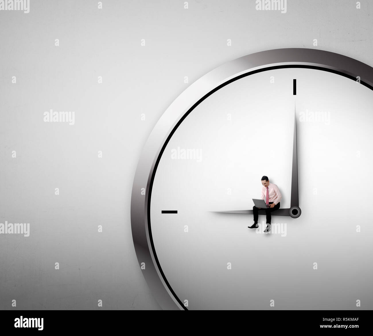 Business Man Sitting On The Clock Stock Photo - Alamy