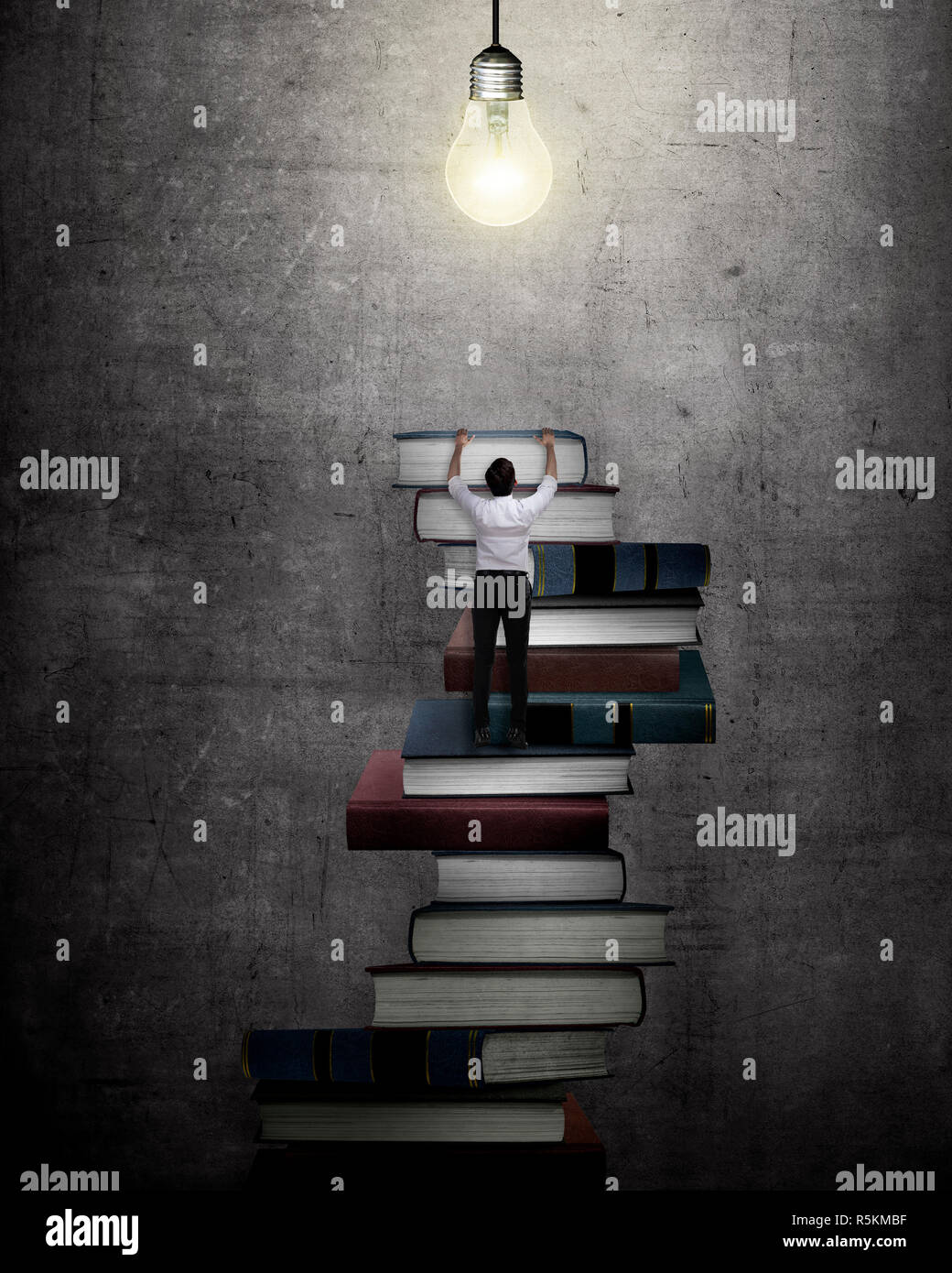 Man white shirt reading stack of books hi-res stock photography and ...