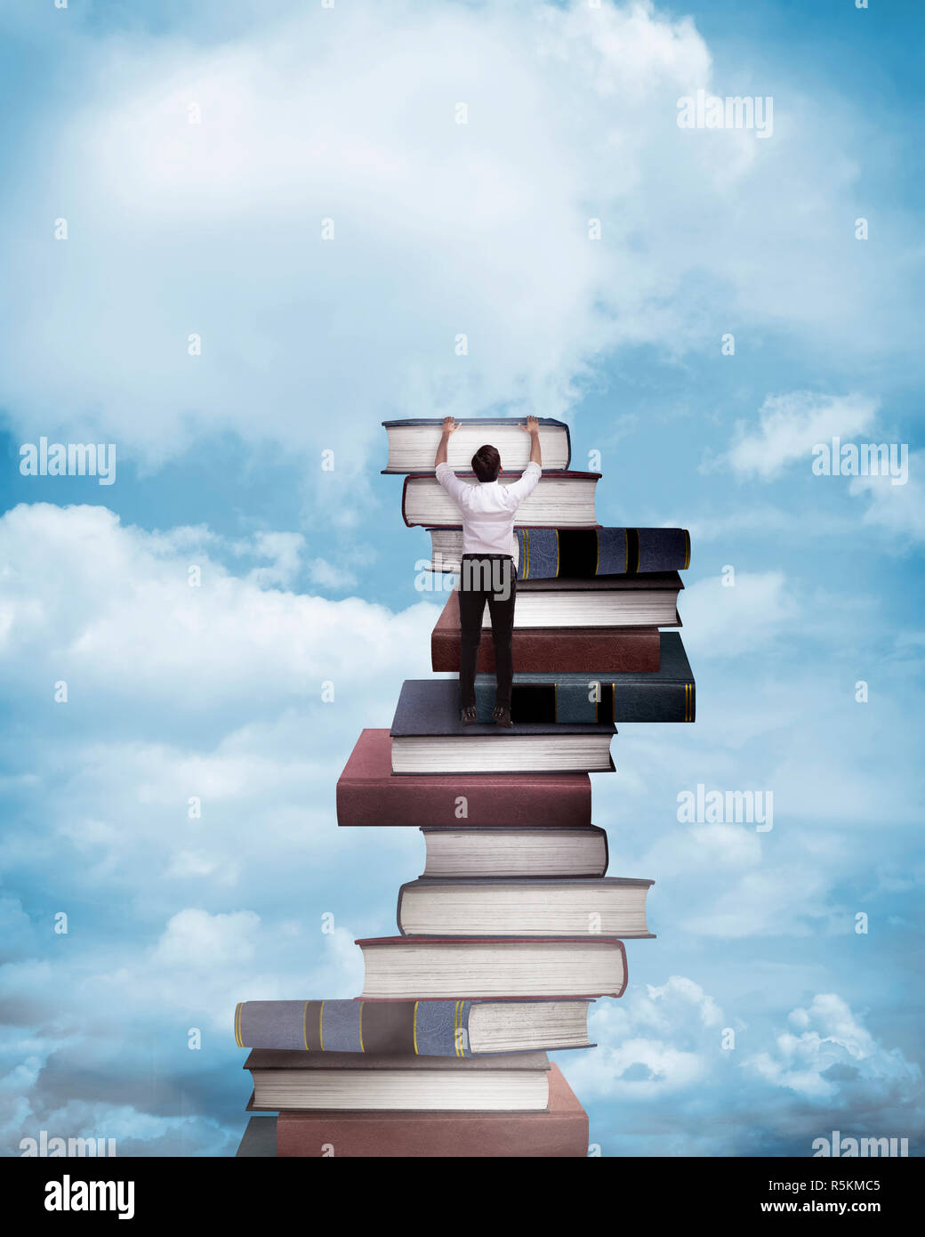 Asian business man climbing book Stock Photo - Alamy