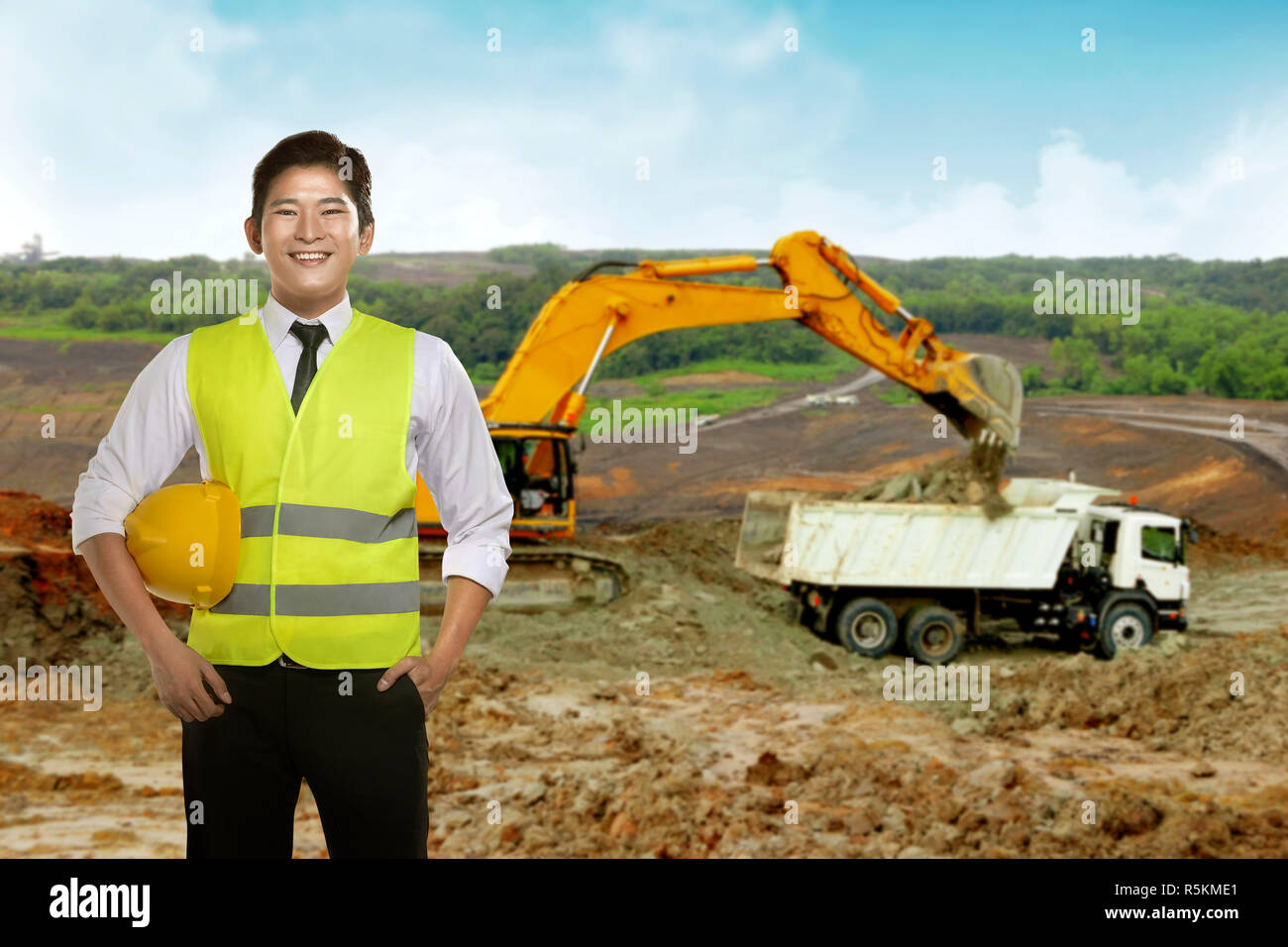 Asian engineer wearing safety vest Stock Photo - Alamy