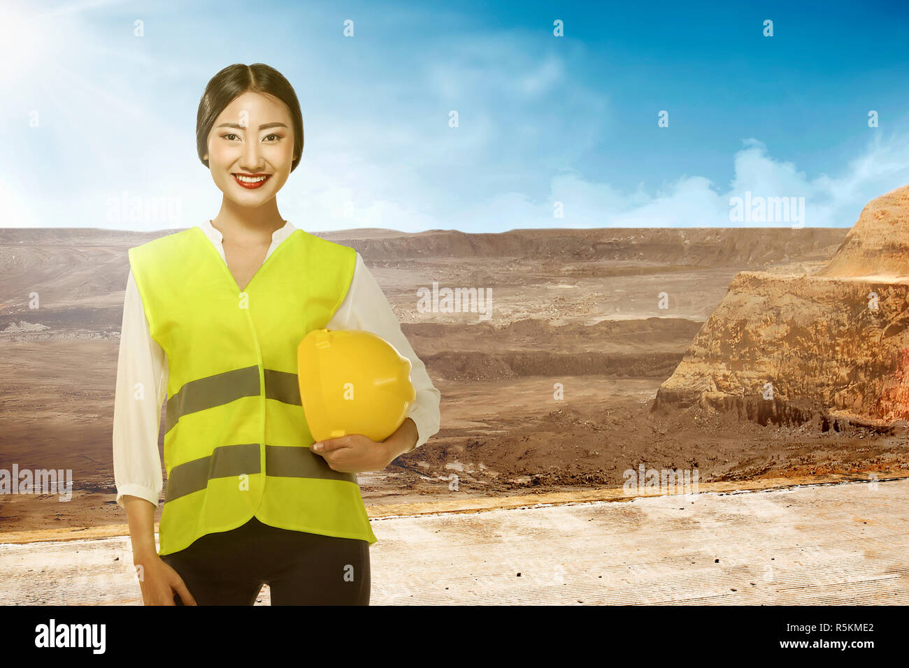 Asian engineer wearing safety vest Stock Photo - Alamy