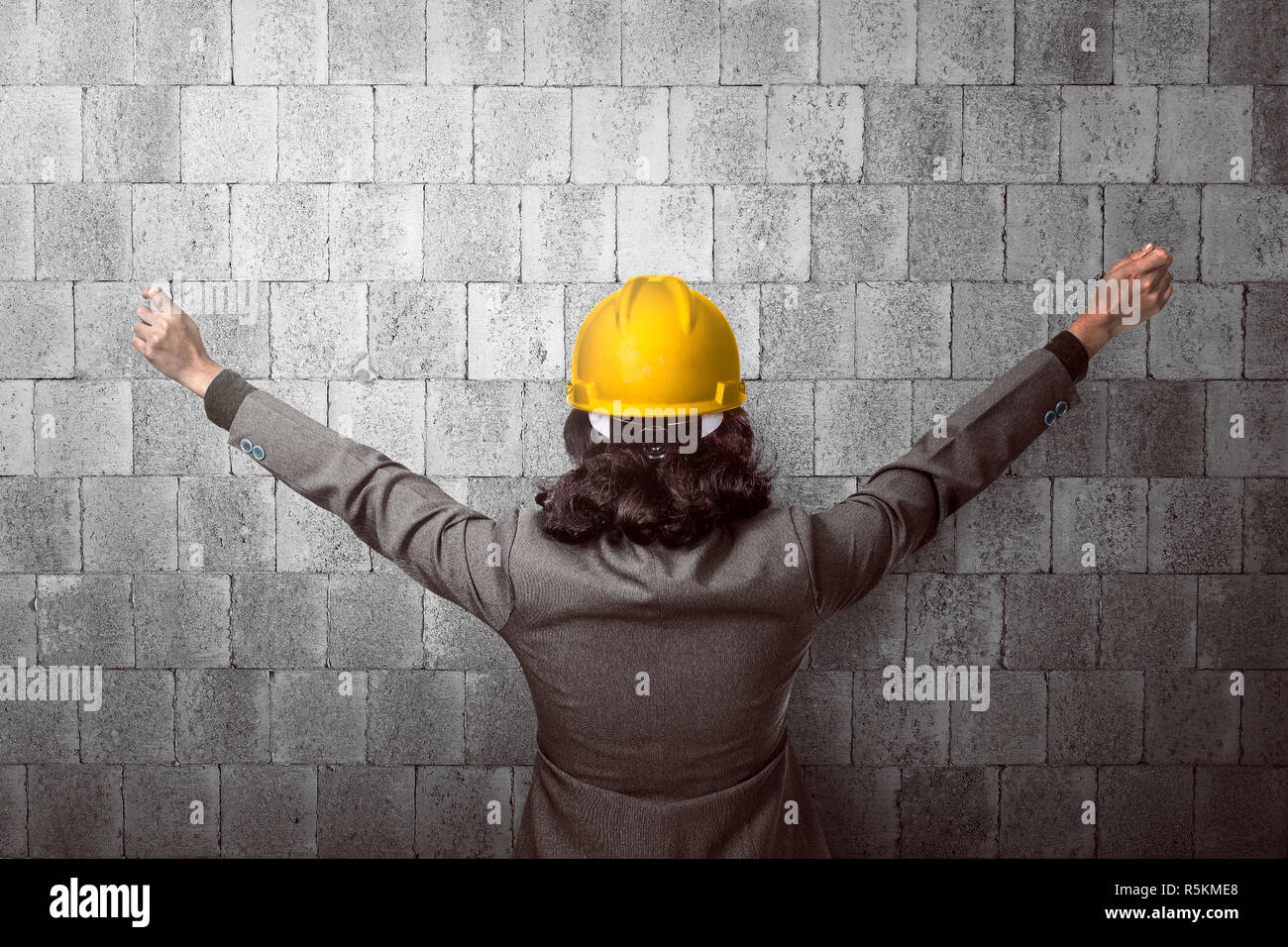 Back view architect raise hand Stock Photo - Alamy