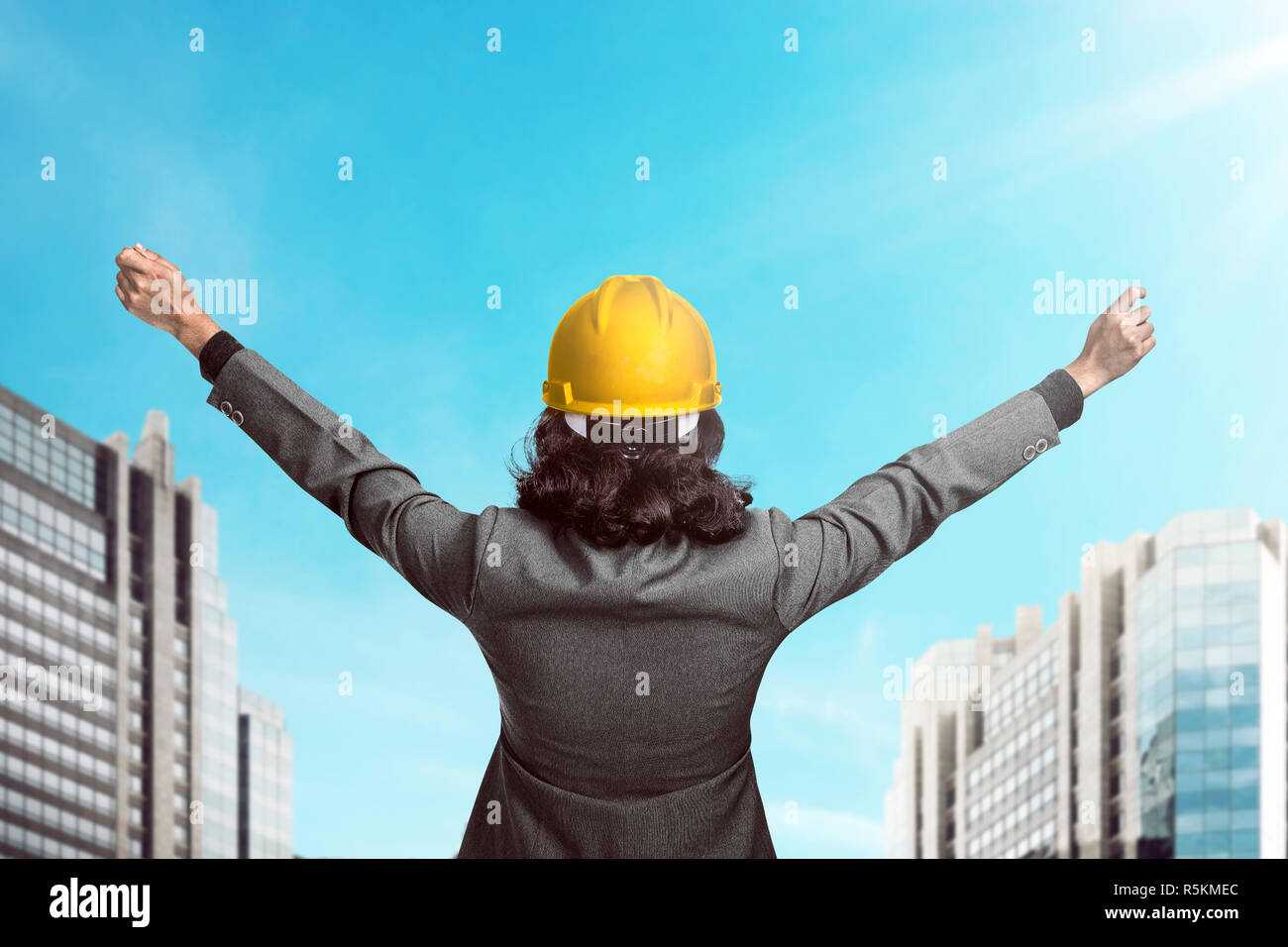 Back view architect raise hand Stock Photo - Alamy