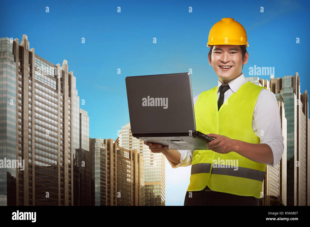 Asian engineer wearing safety vest Stock Photo - Alamy