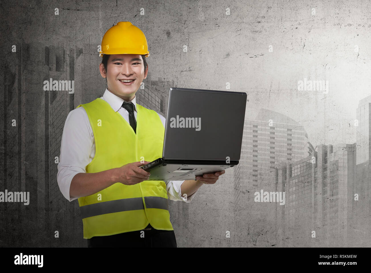 Asian engineer wearing safety vest Stock Photo - Alamy