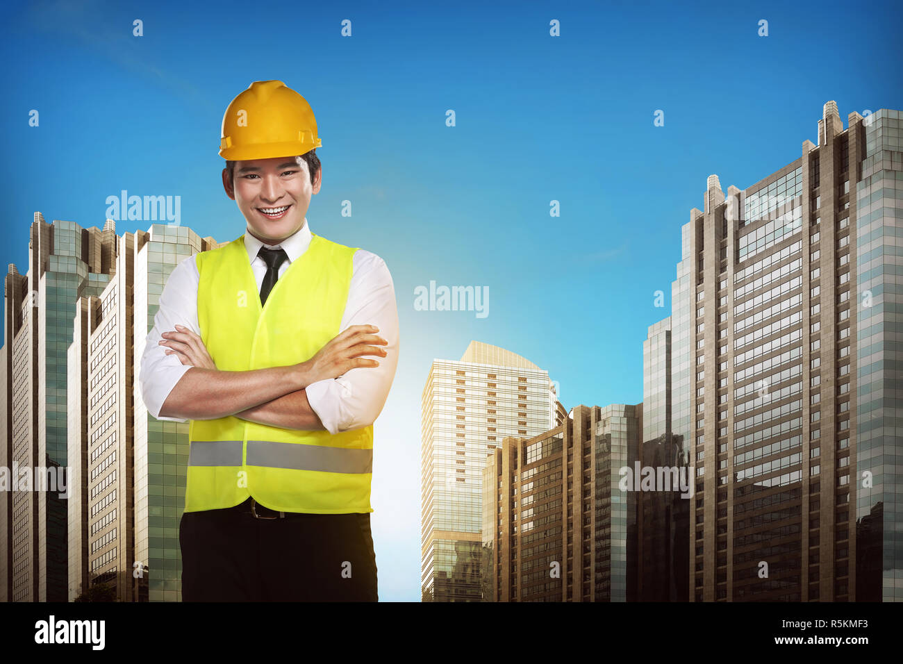 Asian engineer wearing safety vest Stock Photo - Alamy