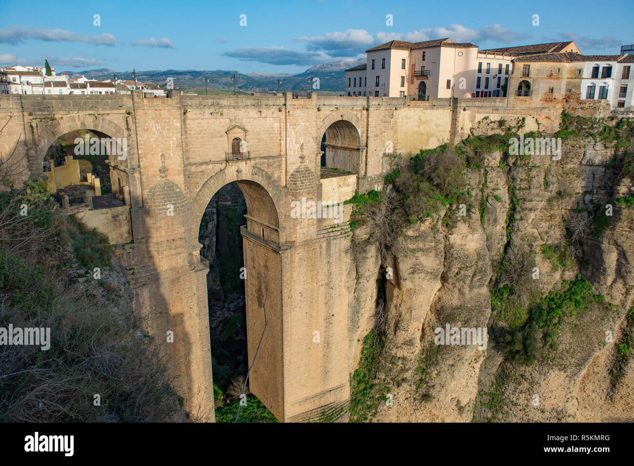 View of the medieval Puente Nuevo (New Bridge) spanning a gorge in the ...