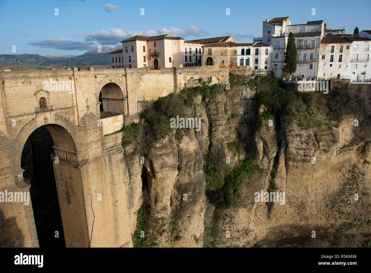 View of the medieval Puente Nuevo (New Bridge) spanning a gorge in the ...