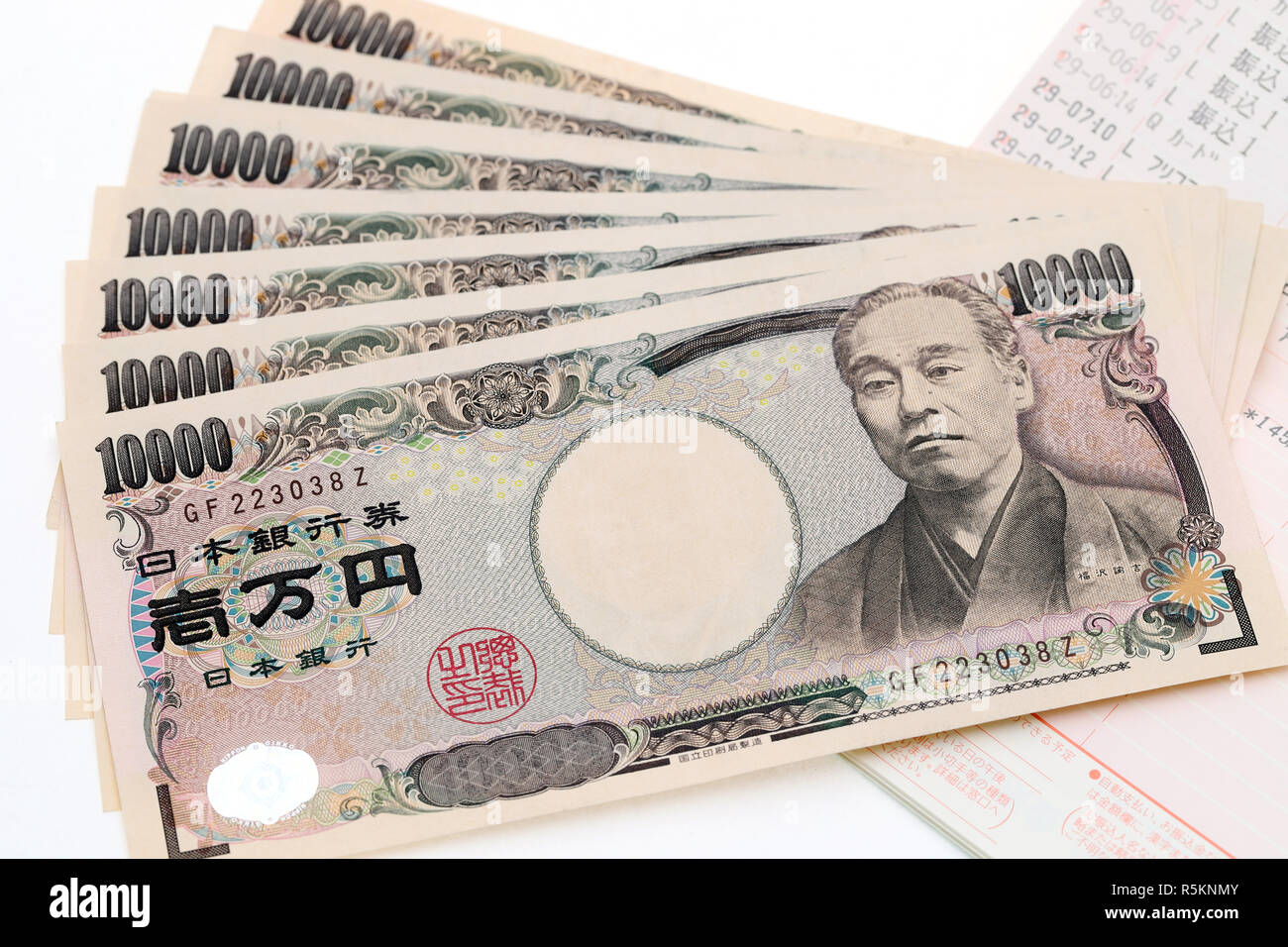 Japanese money and bankbook isolated on white background Stock Photo ...