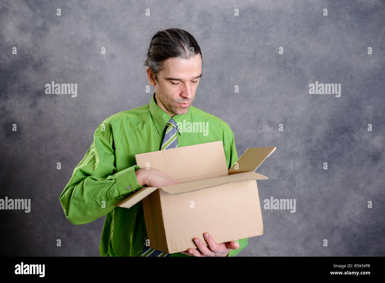 man opening a package Stock Photo - Alamy