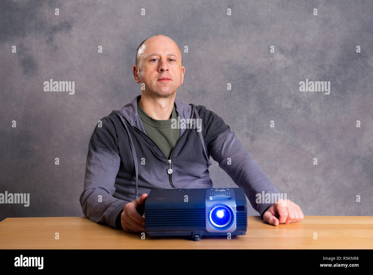 young man with projector watch good film Stock Photo - Alamy