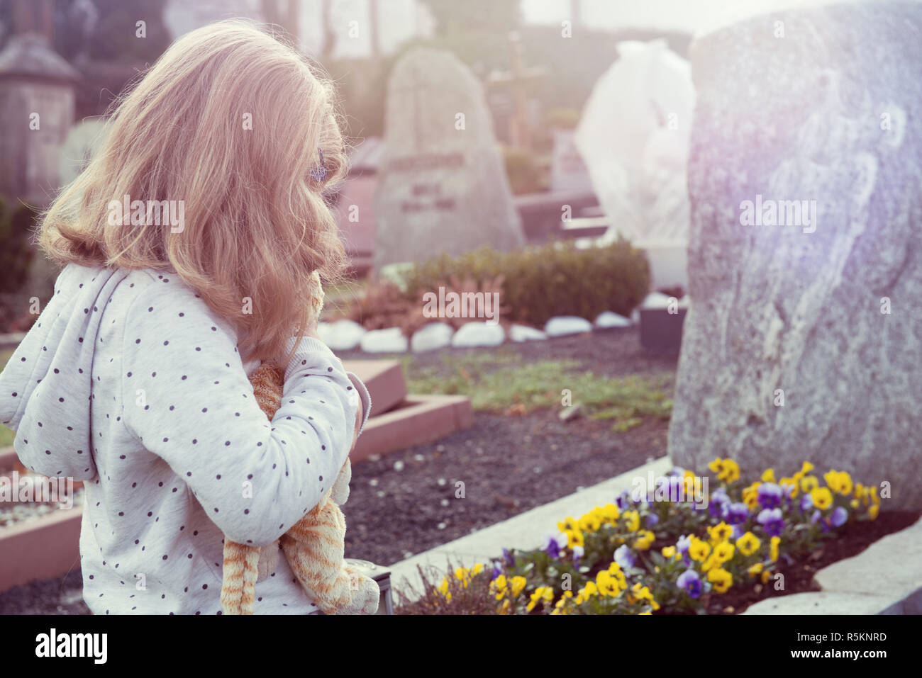 sad girl in front of grave Stock Photo - Alamy