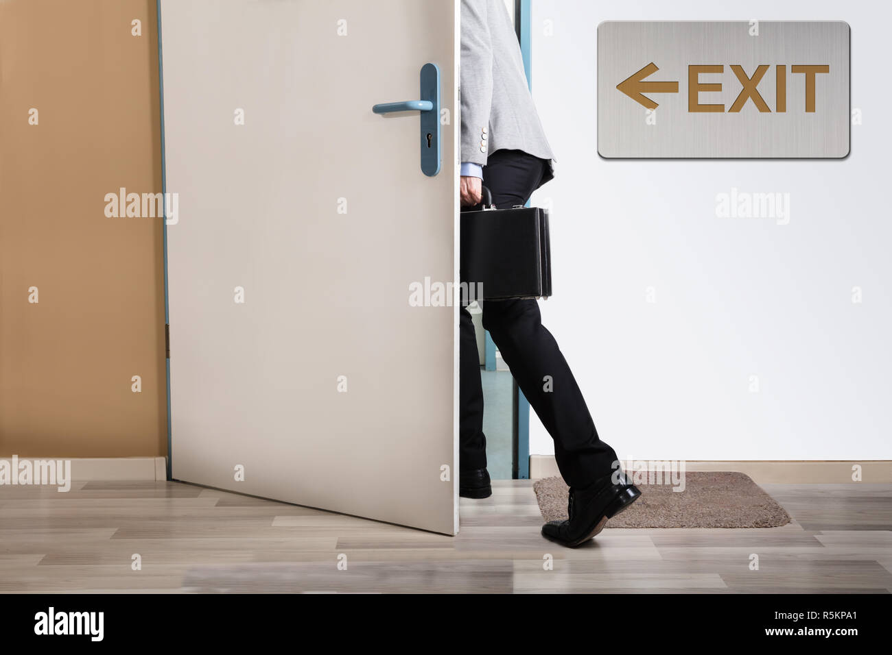 Businessperson Walking Out Stock Photo - Alamy