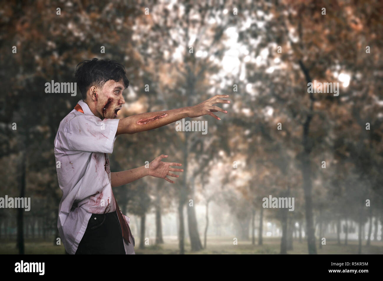 Scary asian zombie man with wounded face Stock Photo - Alamy