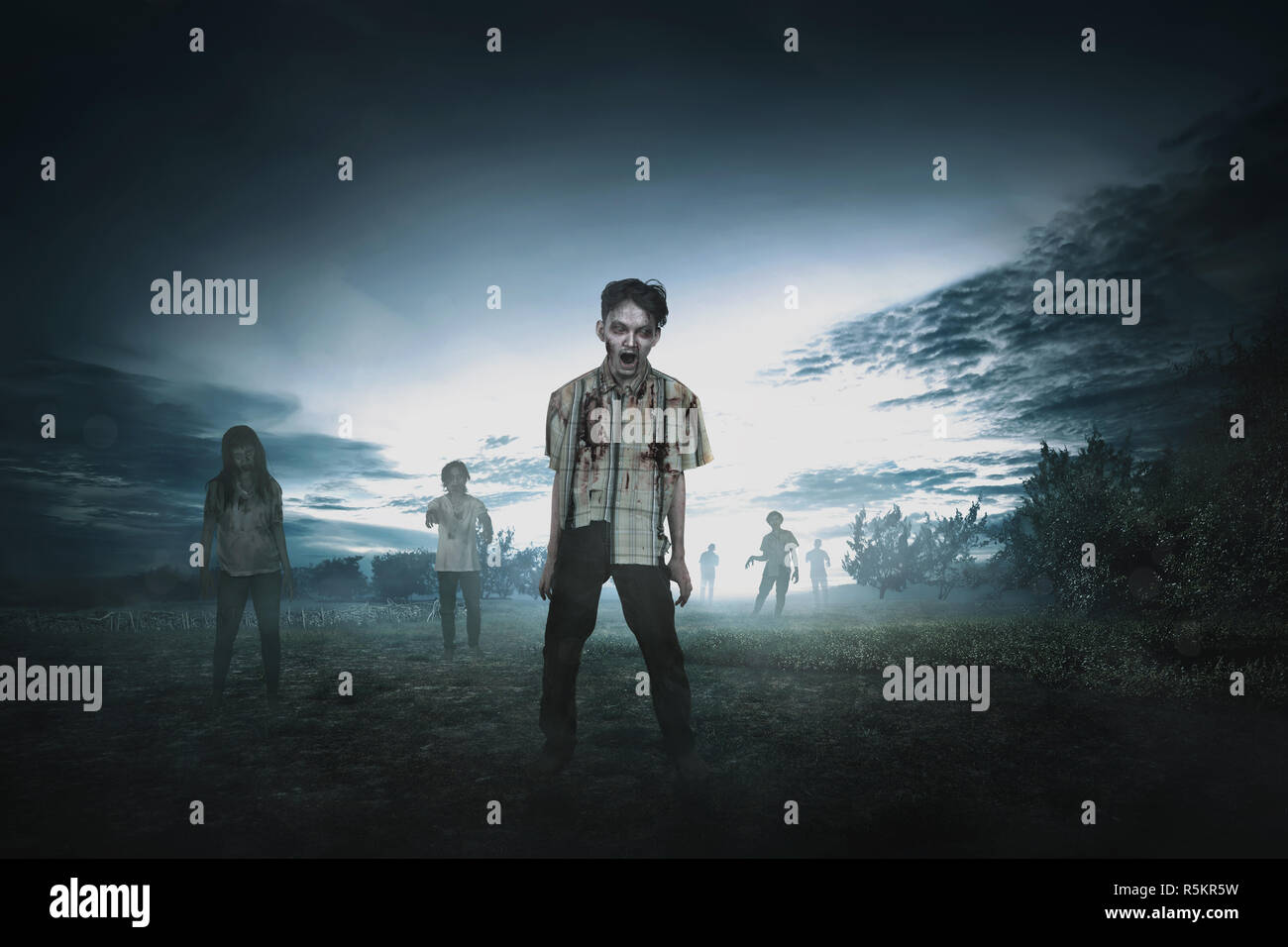 Crowd of aggressive asian zombies walking around Stock Photo - Alamy