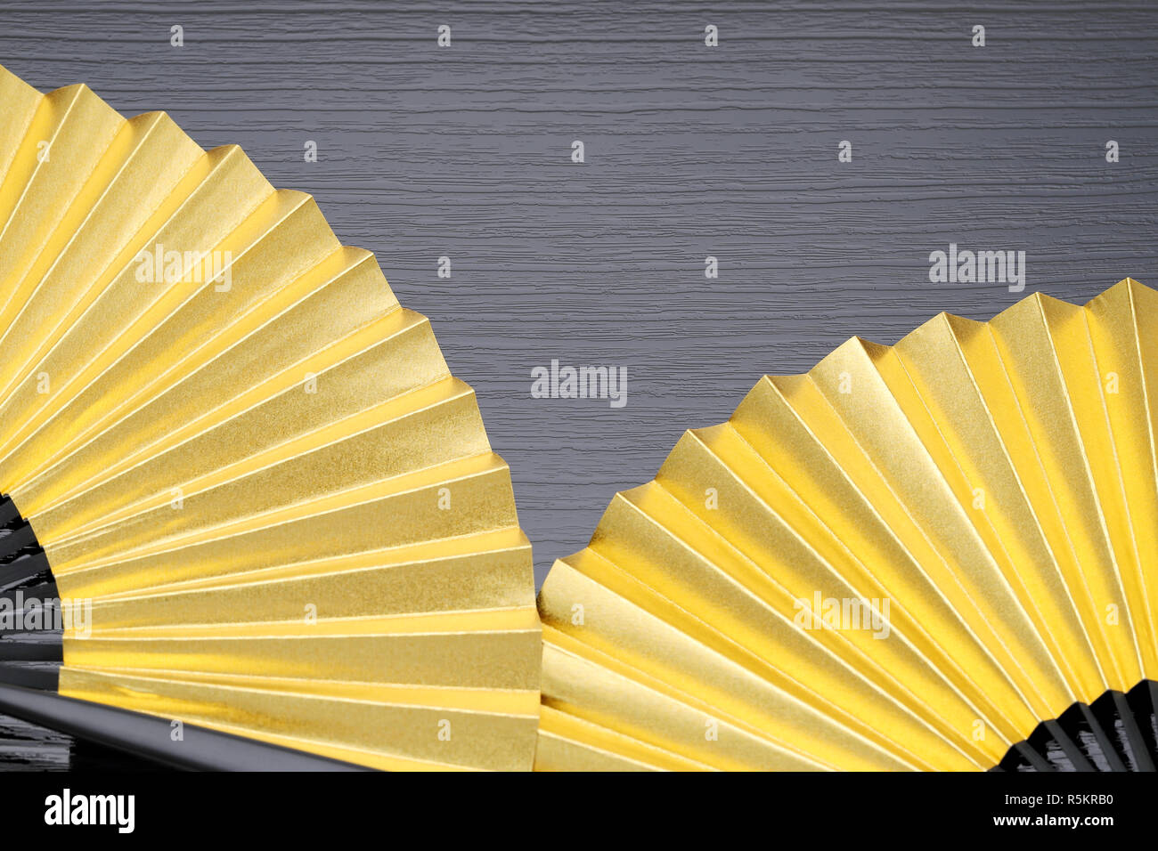 traditional japanese style golden hand fan on gray background Stock ...