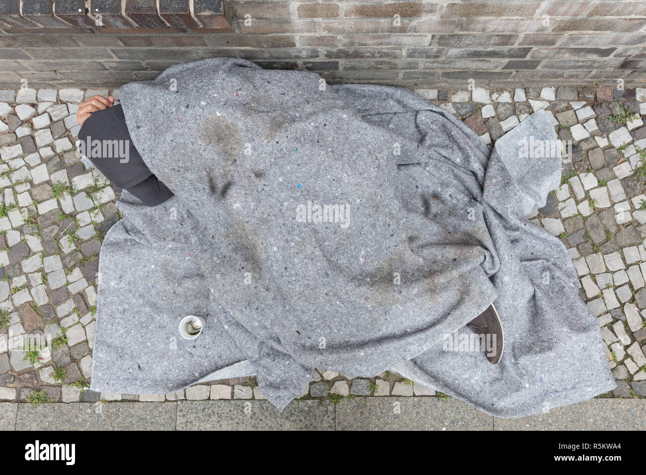 Homeless Man Sleeping On Street Stock Photo - Alamy