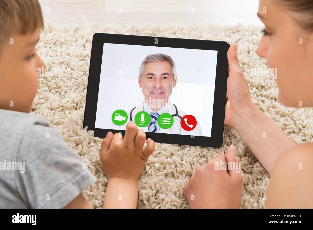 Mother And Son Solving Math Problem On Digital Tablet Stock Photo - Alamy