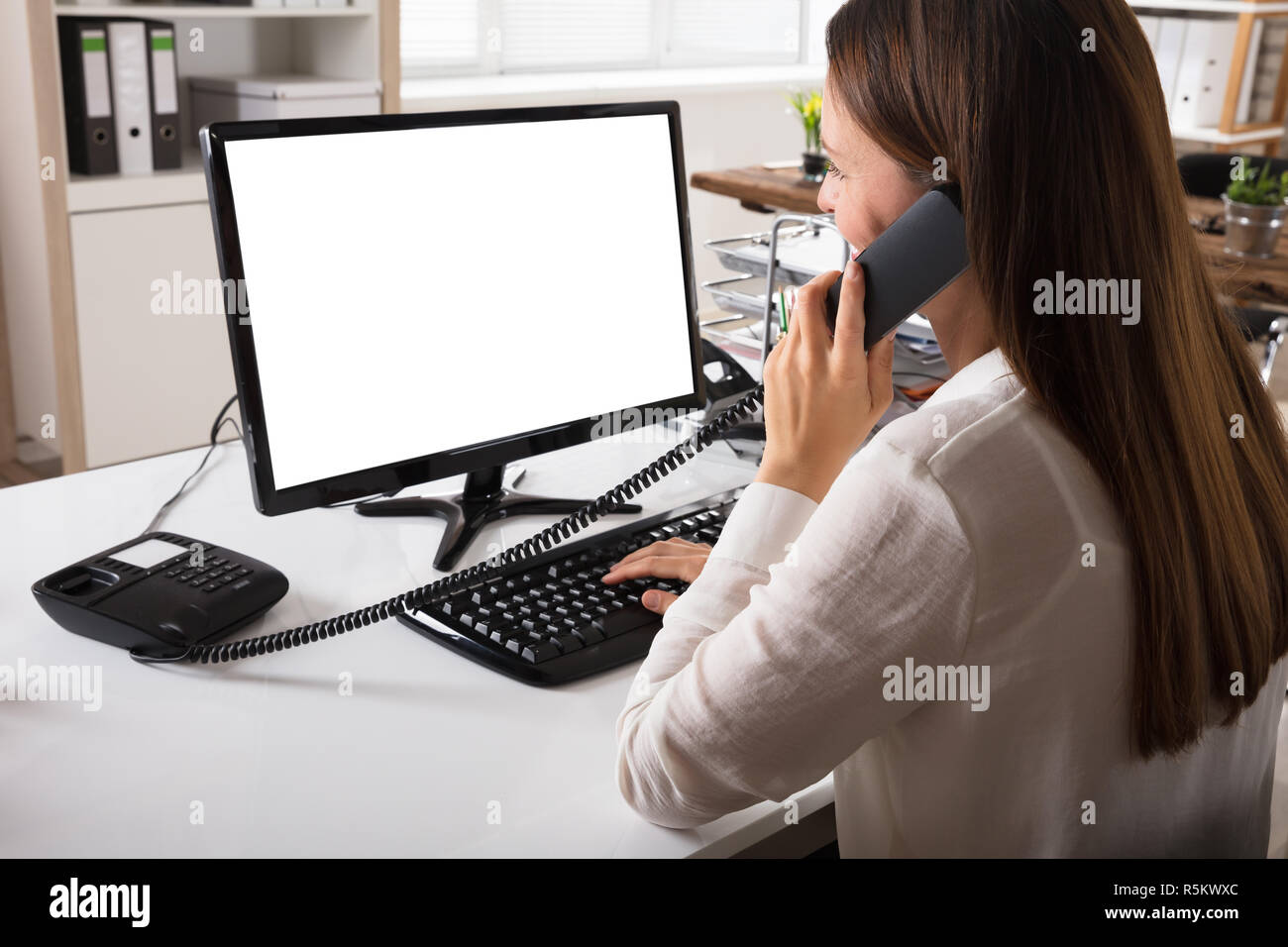 Mobile phone landline phone telephone workplace hi-res stock ...