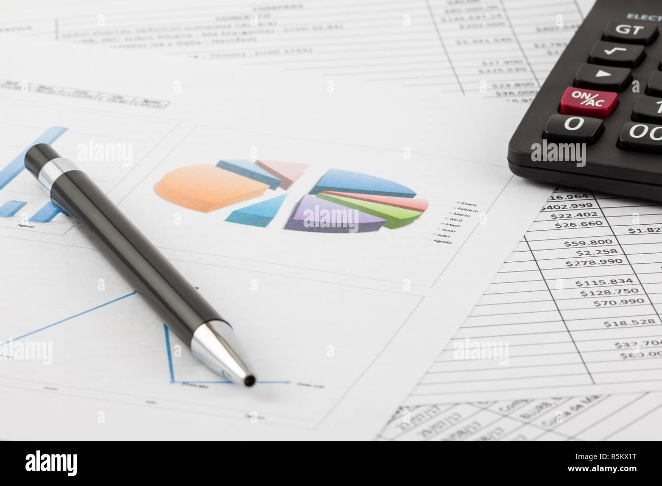 Monthly budget spreadsheet, pen and calculator Stock Photo - Alamy