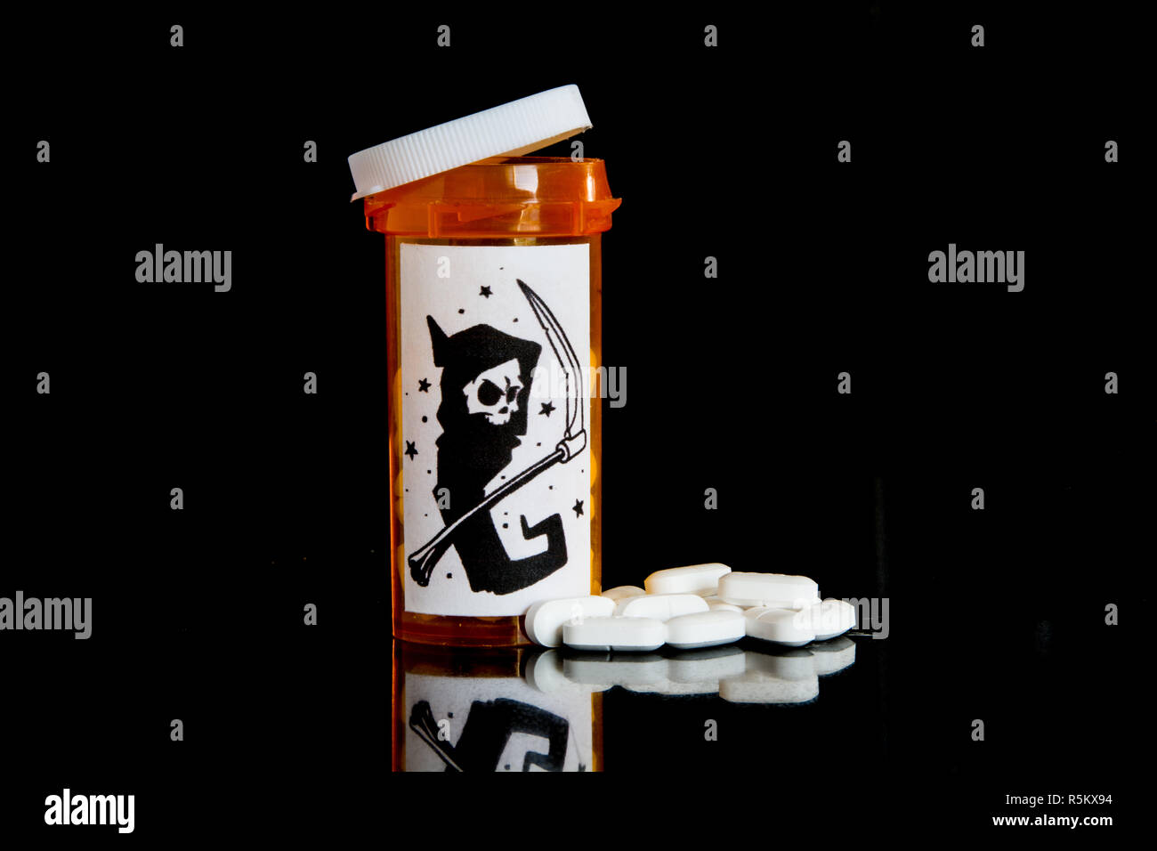 Grim reaper with pills Stock Photo - Alamy