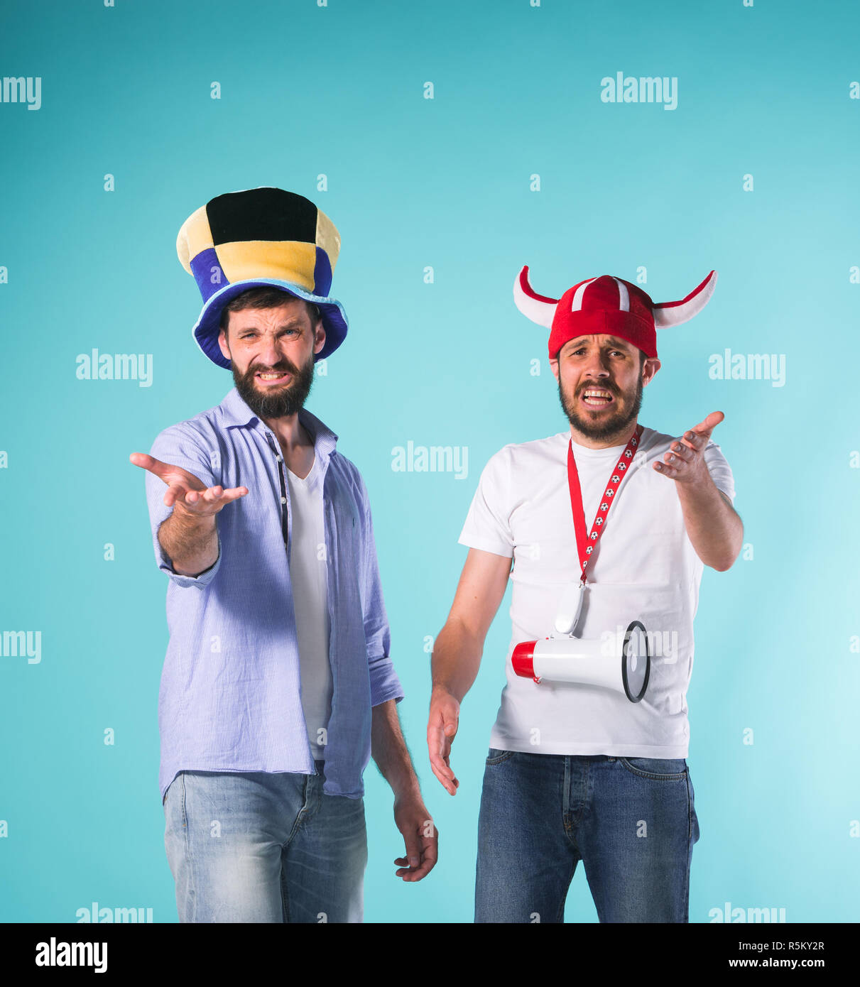 The two football fans over blue Stock Photo - Alamy