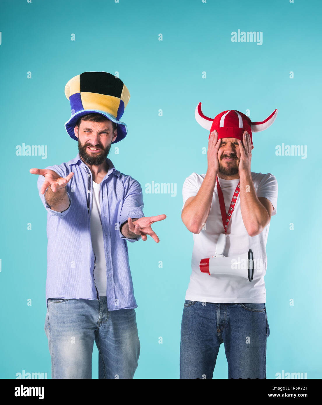 The two football fans over blue Stock Photo - Alamy