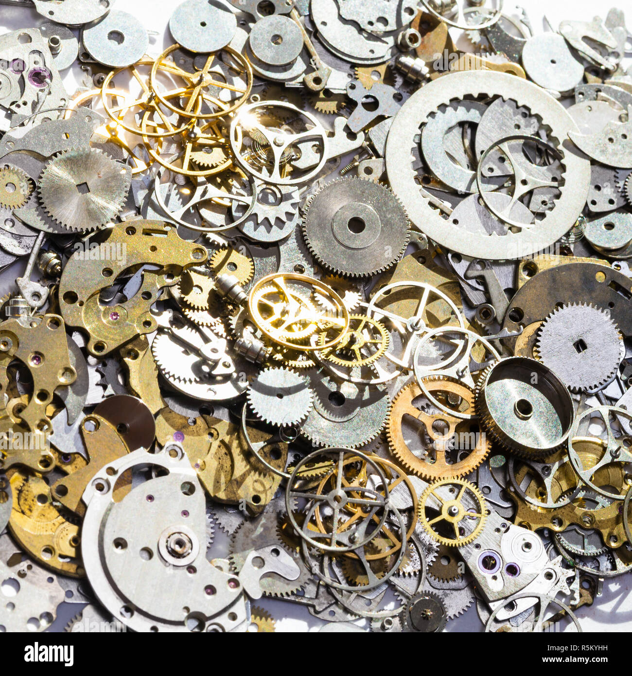 pile of used watch spare parts close up Stock Photo - Alamy