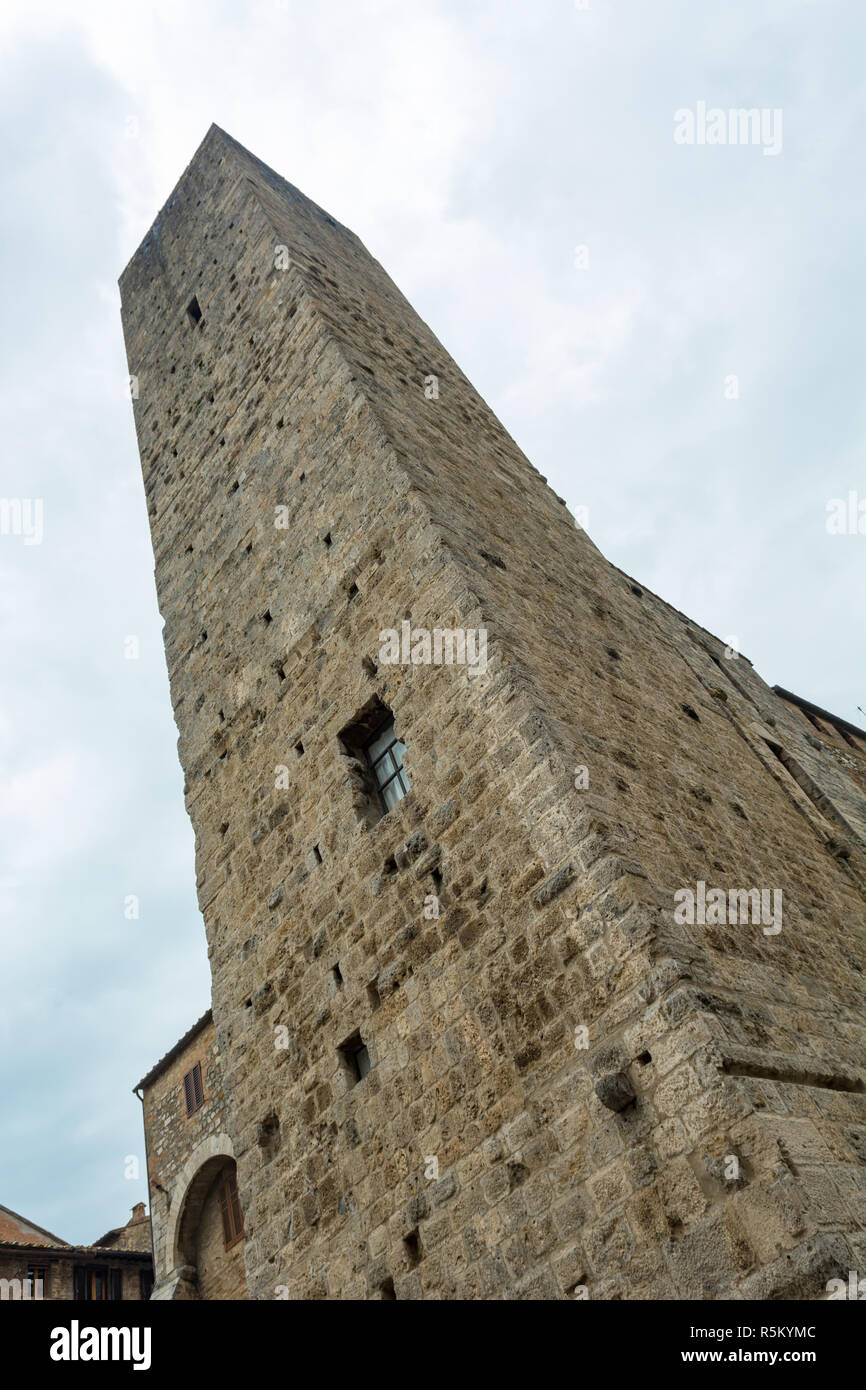 Spectacular stone built tower raising above medieval town Stock Photo ...
