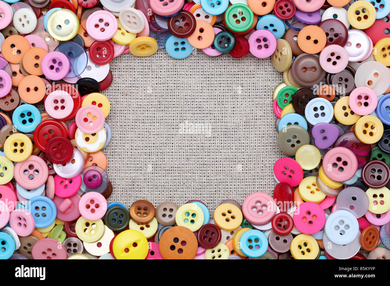 buttons frame with colored buttons on fabric texture background Stock ...