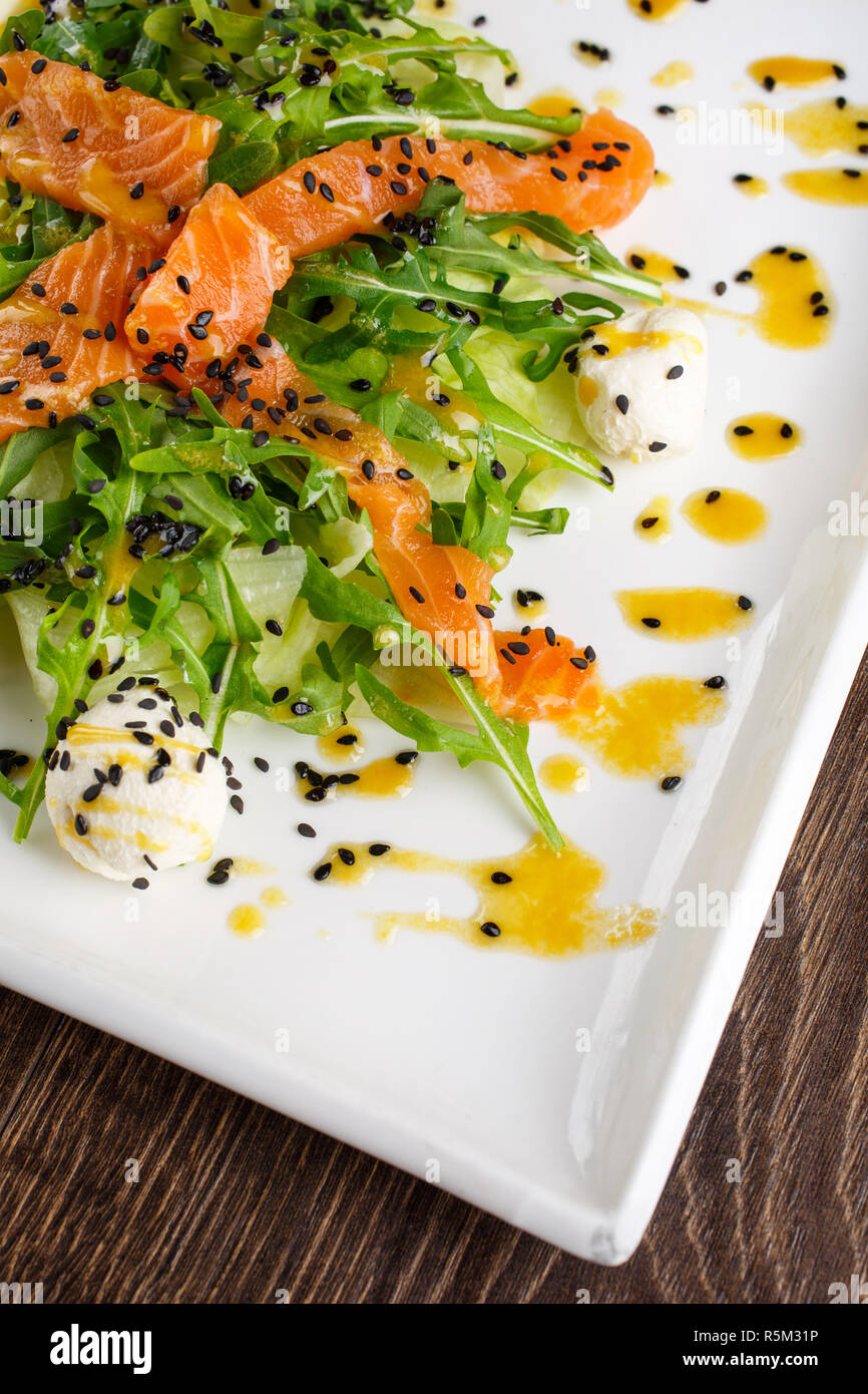 Restaurant healthy food - fish salad Stock Photo - Alamy