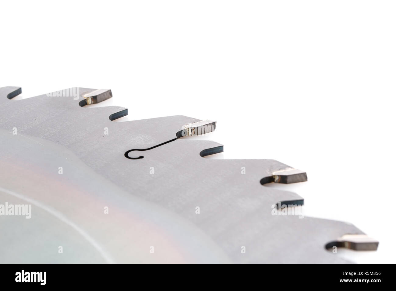 Circular saw teeth on a white background Stock Photo - Alamy
