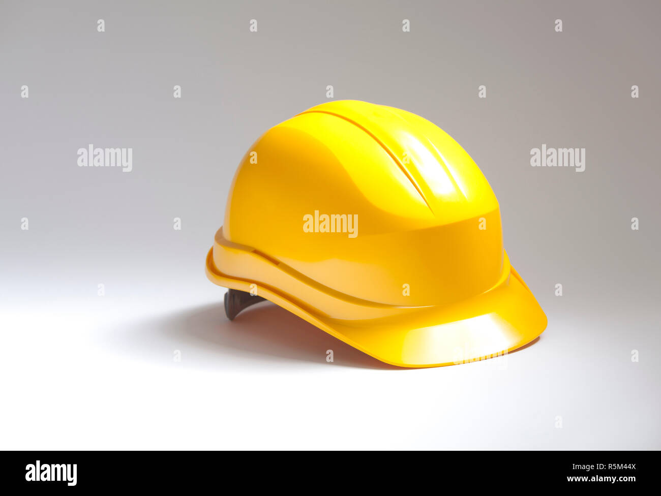 Yellow safety helmet Stock Photo - Alamy