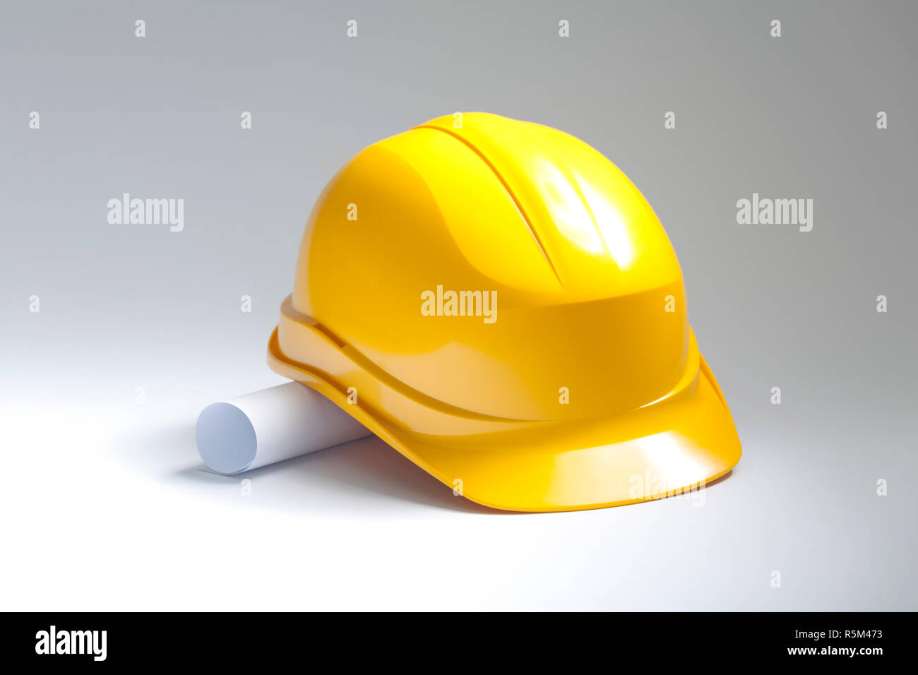 Yellow safety helmet with drawings Stock Photo - Alamy