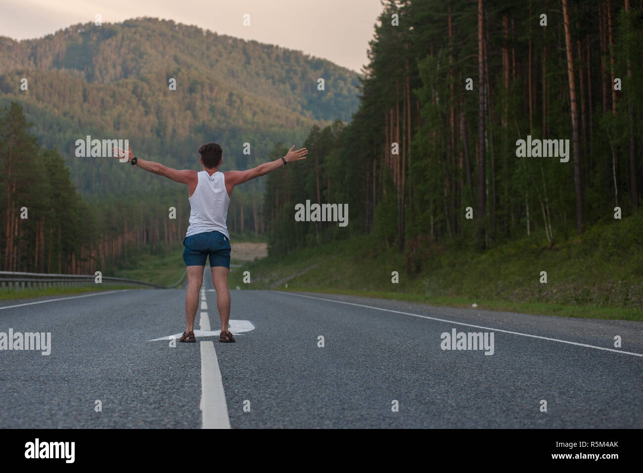 Man laying on the road Stock Photo - Alamy