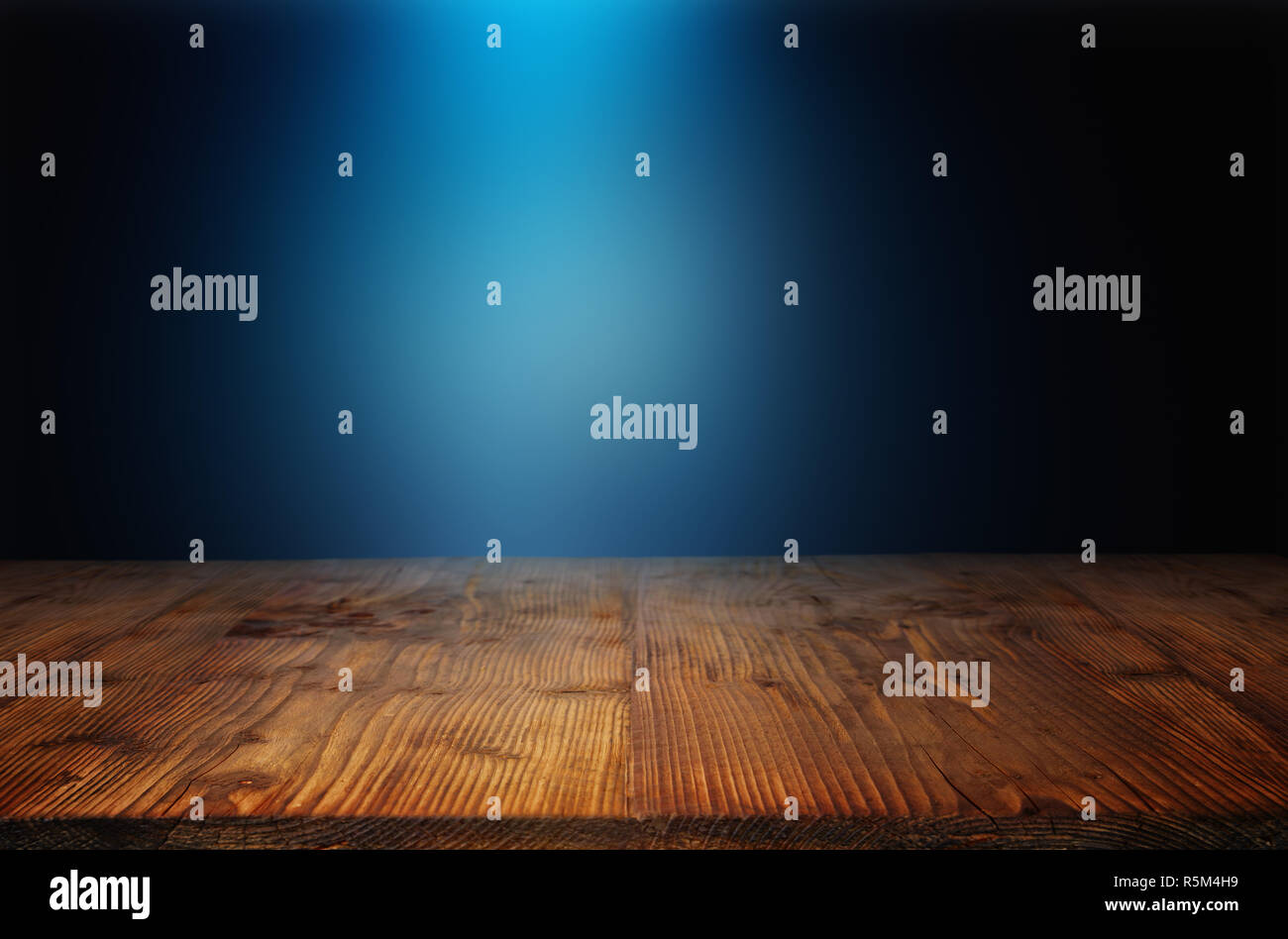 wooden table with blue light beam Stock Photo - Alamy