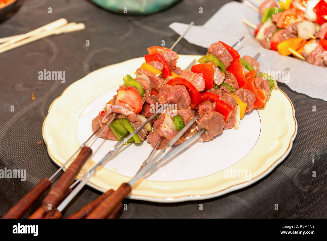 preparations of meat skewers for barbecue Stock Photo - Alamy