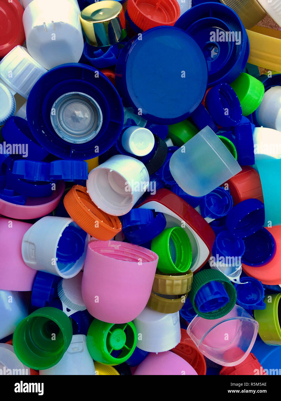 used plastic lids,recycled material Stock Photo - Alamy