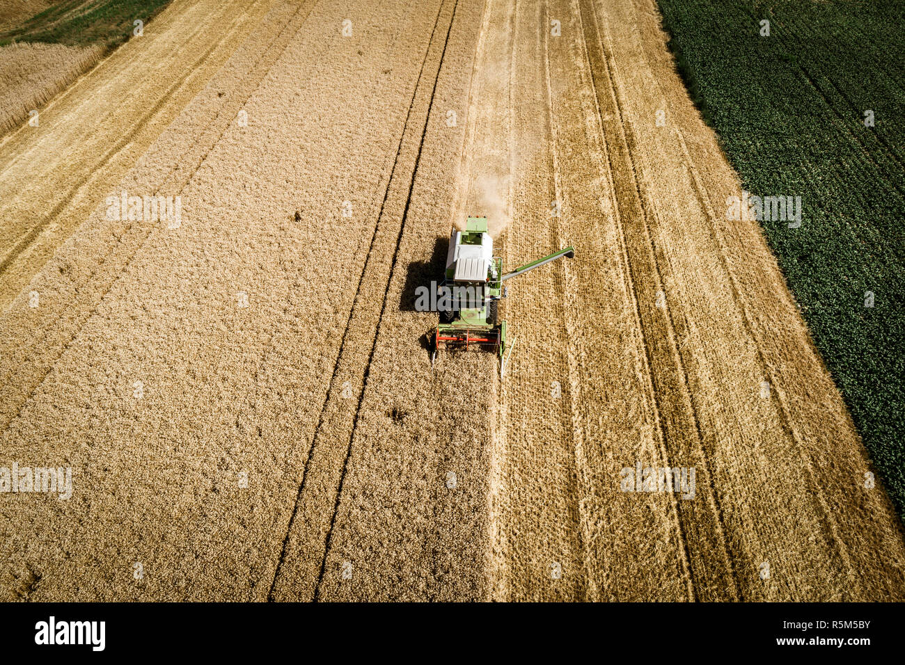 Aerial wheat harvest combine drive hi-res stock photography and images ...
