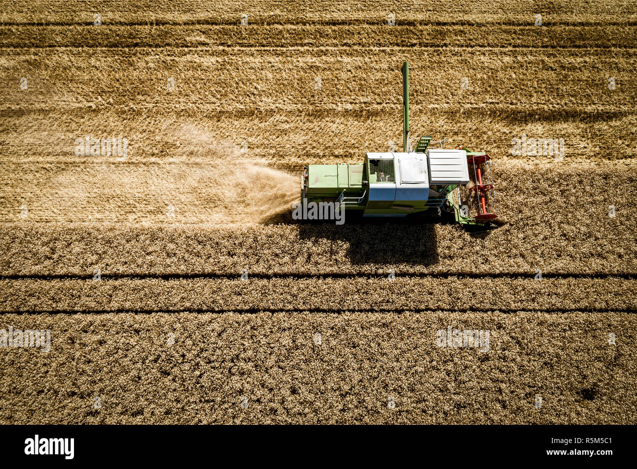 Aerial wheat harvest combine drive hi-res stock photography and images ...