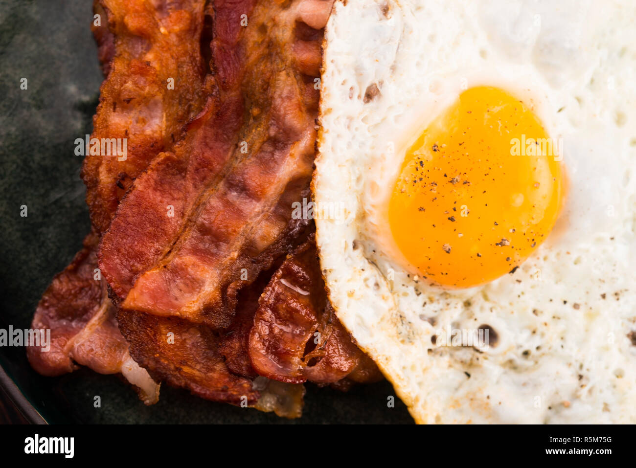 Fried Egg And Bacon Rashers Stock Photo - Alamy