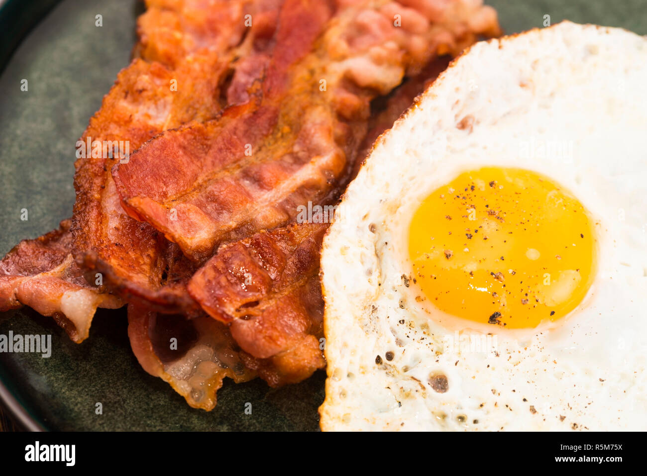 Fried Egg And Bacon Rashers Stock Photo - Alamy