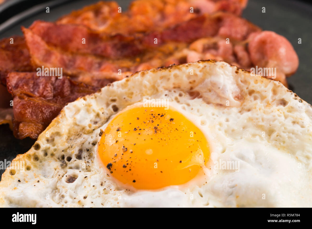 Fried Egg And Bacon Rashers Stock Photo - Alamy