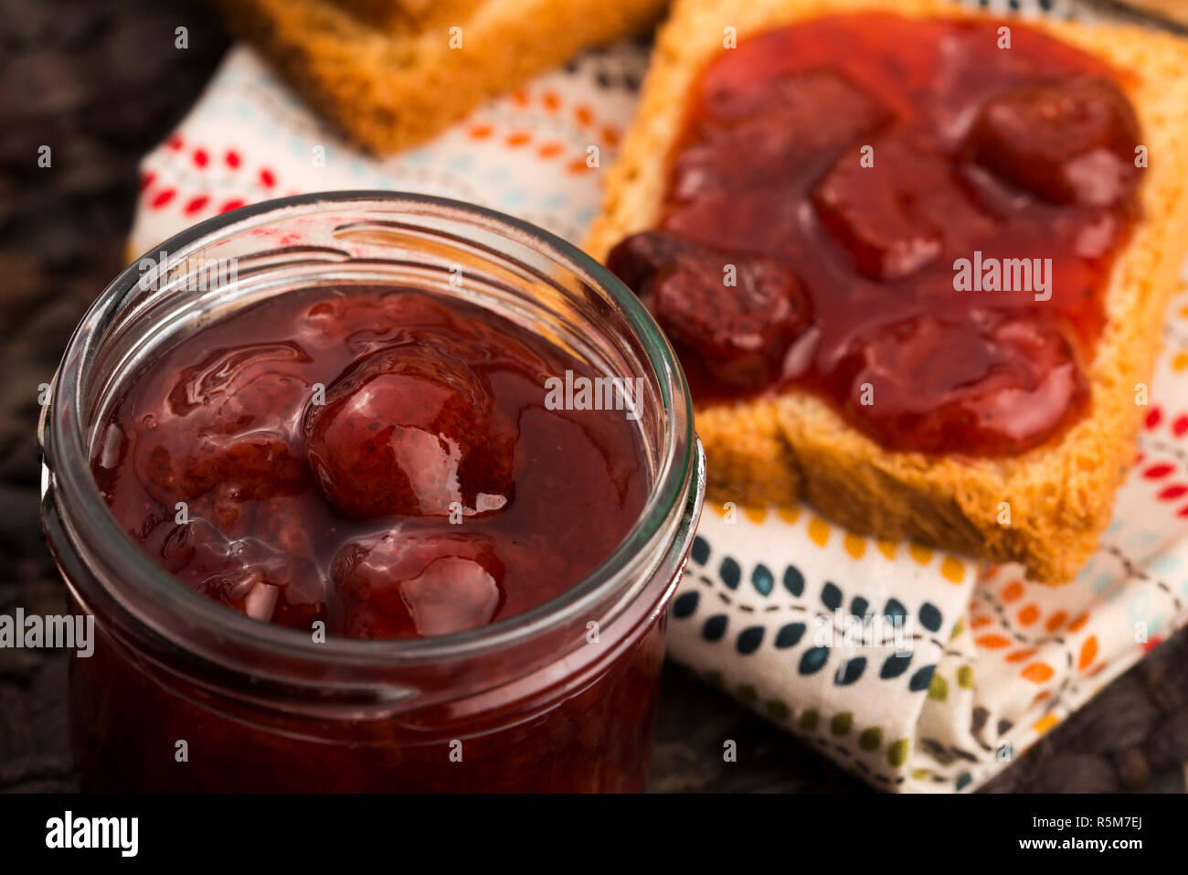 Breakfast of cherry jam on toast Stock Photo - Alamy