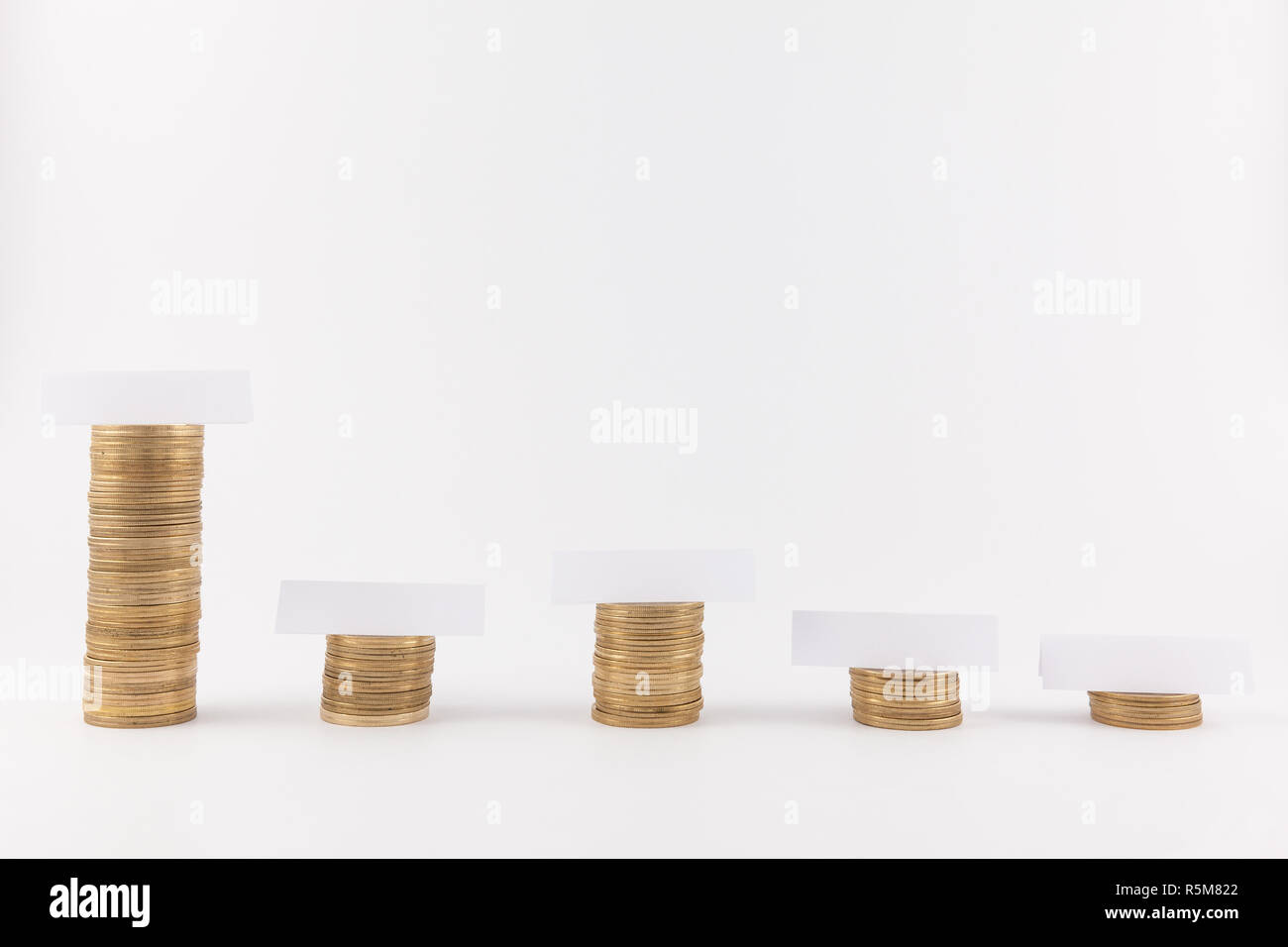 Coin stacks isolated in white background with blank labels Stock Photo ...