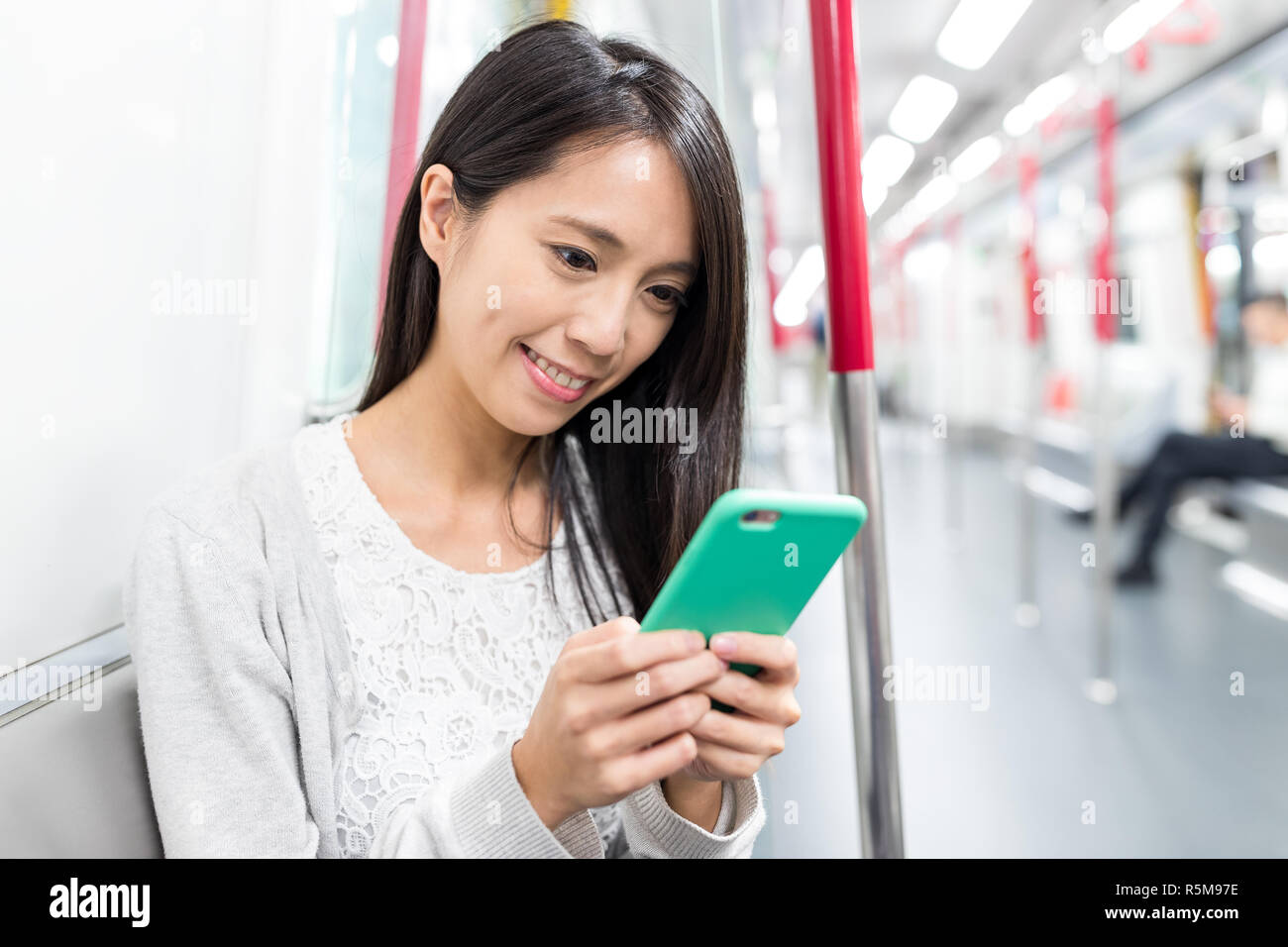 Woman cellphone train compartment hi-res stock photography and images ...