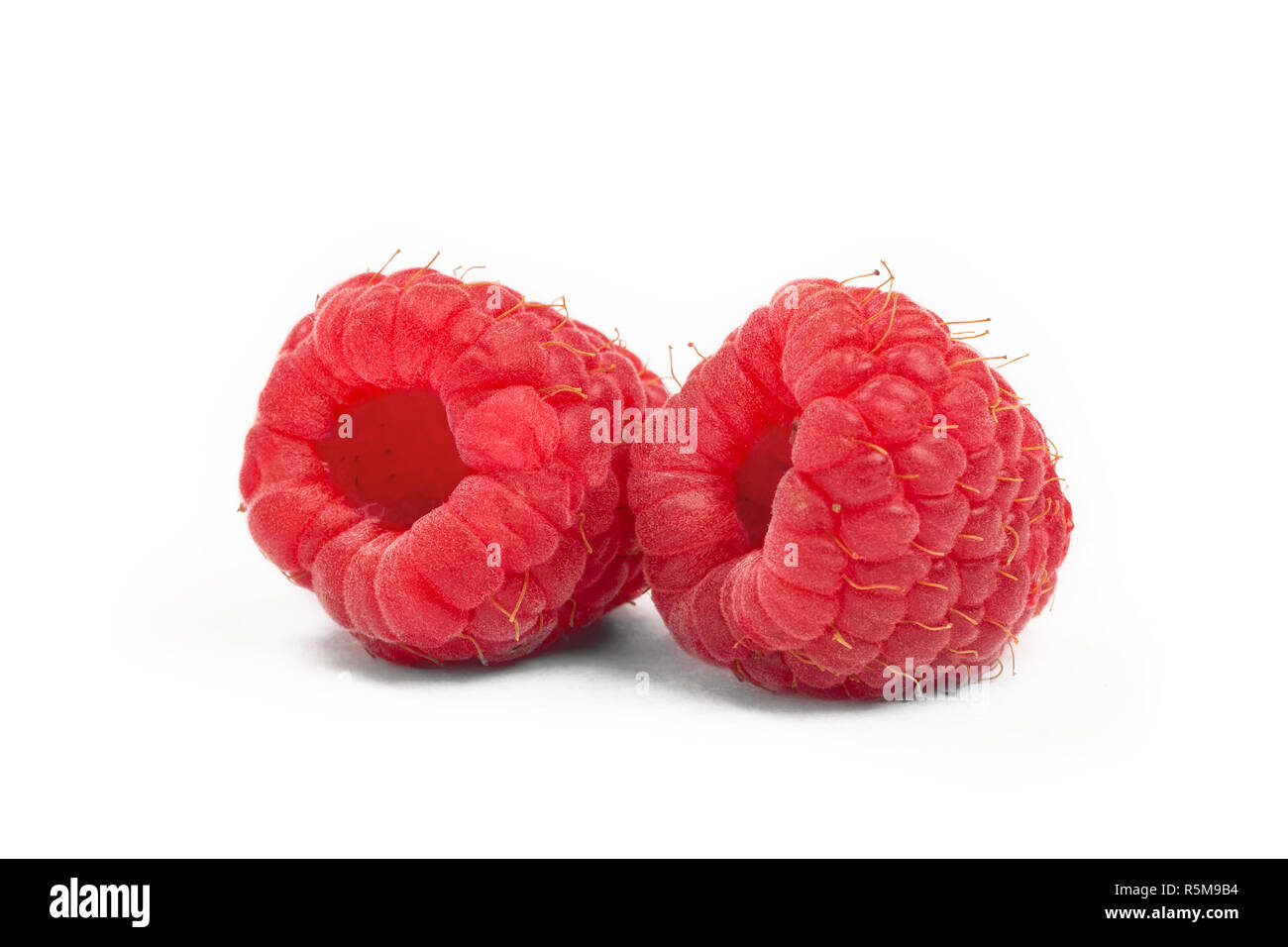 ripe raspberries isolated on white background close up Stock Photo - Alamy