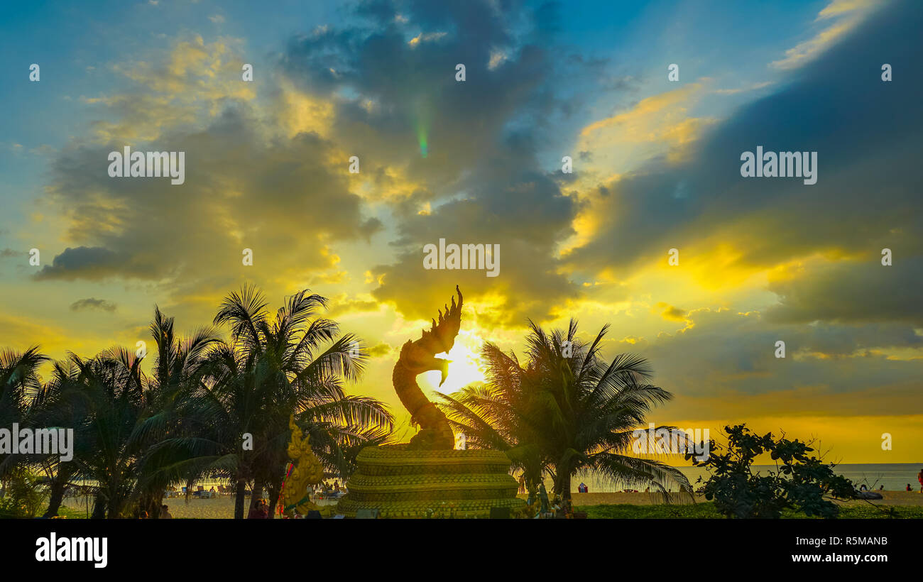 sunset above Naka snake sculpture at Karon beach Naka god of snake ...