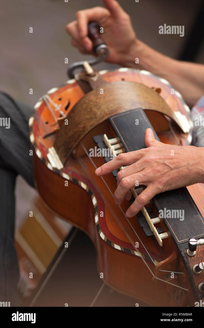 Playing old Britain instrument Stock Photo - Alamy